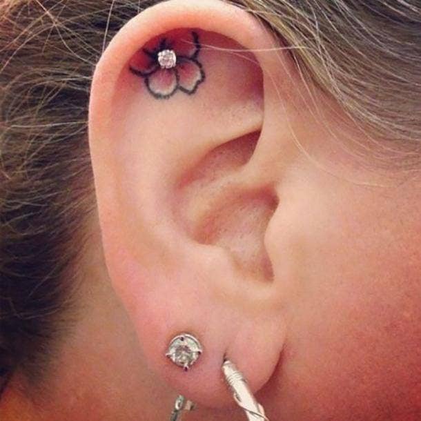 29 Tattoo Design Ideas With Dermal Piercings To Add Glam To Your Ink Yourtango